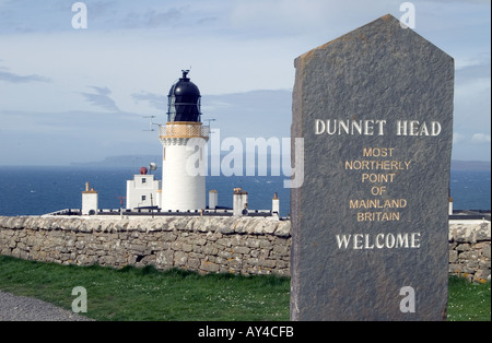 Light post and stone tower over rocky terrain in the large wall of ...