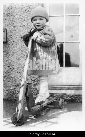 BOY ON HOME-MADE SCOOTER Stock Photo - Alamy