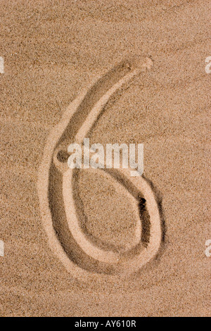 number six written on the sand Stock Photo - Alamy