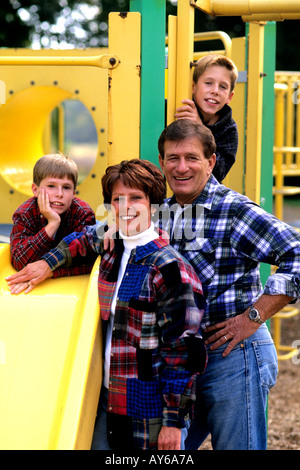 Children with Parents on Playground Fall Setting Stock Photo - Alamy