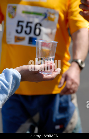 People Passing Out Cups of Water During A Marathon Stock Photo - Alamy