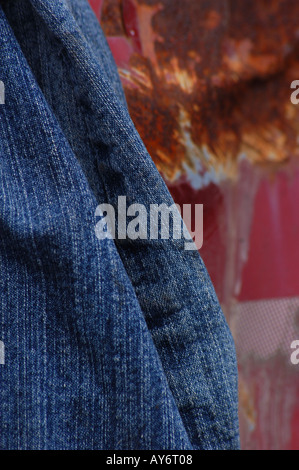 Vertical background image of blue denim jeans in row on clothing rack ...