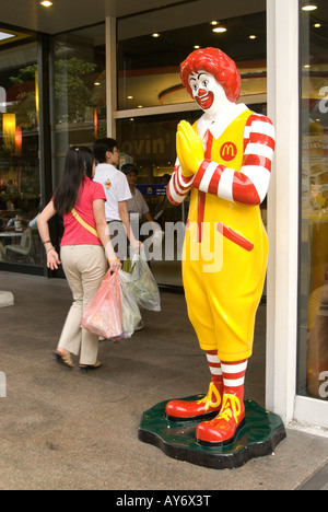 Ronald McDonald greeting customers with the traditional Thai greeting called a wai at the ...