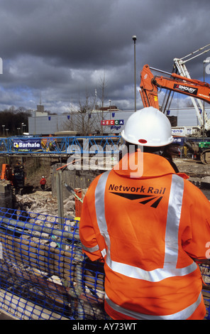 Network rail engineers with bright orange PPE clothing on the East ...