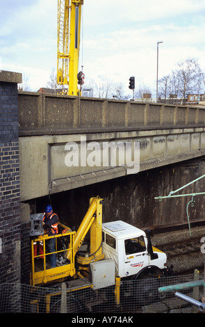 Workers works at a railway bridge in Ahmedabad, India, Sunday, Feb. 1 ...