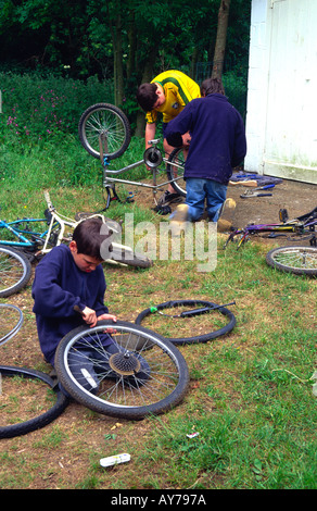Children fixing their bikes Stock Photo - Alamy