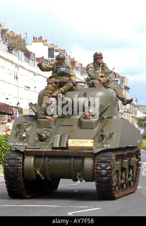 Sherman tank in action during World War II. The M4 Sherman, officially ...