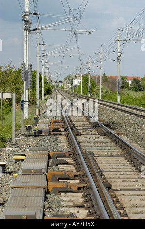 Rails on embankment with switch Stock Photo - Alamy
