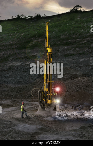Drill rigs in opencast gold mine, preparing for blasting by drilling ...