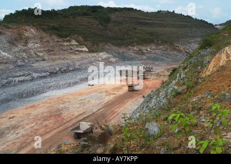 Overview of surface opencast gold mine, with drill rigs preparing for ...