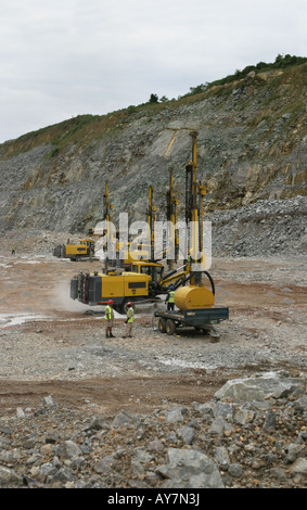 Drill rigs in opencast gold mine, preparing for blasting by drilling ...