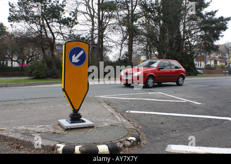 Keep left traffic bollard in the centre of new road Stock Photo ...