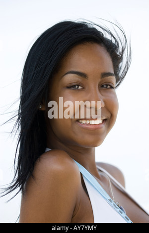 Vertical shot of a Spanish female in black wearing a face mask outdoors ...