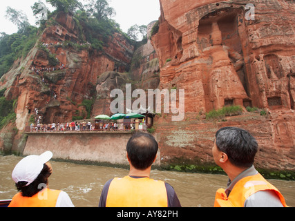 Tourists visit the Leshan Giant Buddha scenic area in Leshan City ...