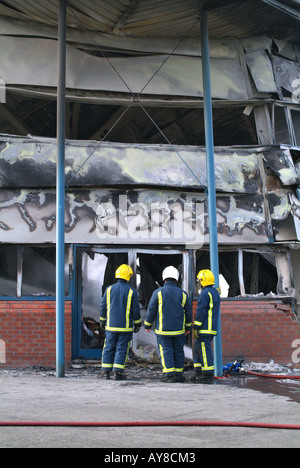 FIREMAN FIGHTING FIRE AT A FACTORY IN ENGLAND Stock Photo - Alamy