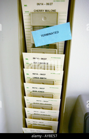Row of employee time cards with one missing and marked ILL Stock Photo ...