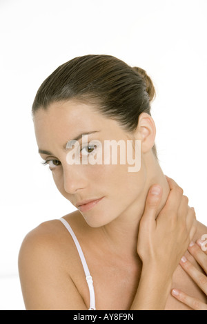 Woman touching the nape of her neck, side view, cropped Stock Photo - Alamy
