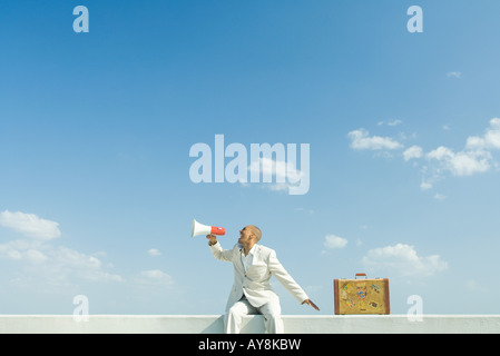 A man holding a megaphone - Open day Stock Photo - Alamy