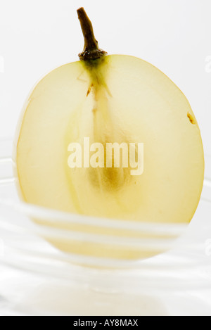 Single cross section of grape-fruit with green leaf Stock Photo - Alamy