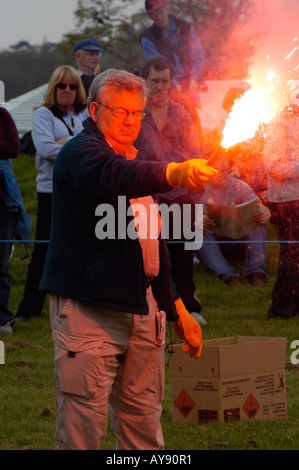 Man demonstrating a distress flare Stock Photo - Alamy