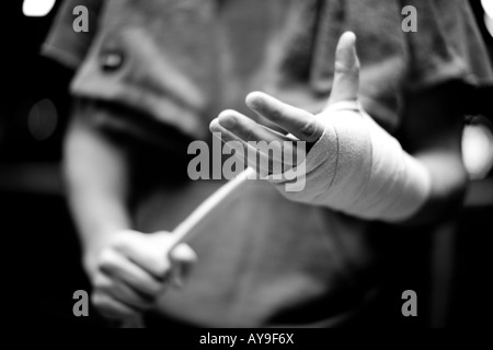 Boxer taping hands in boxing ring Stock Photo - Alamy