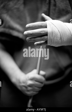 Boxer taping hands in boxing ring Stock Photo - Alamy