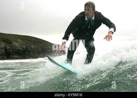 SURFER JOSS ASH SURFING IN A SUIT Stock Photo - Alamy