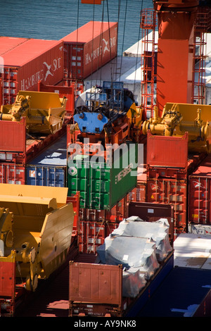 Overhead crane. Lifting cargo container at maritime waterfront ...