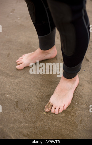 Feet on sand, elevated view Stock Photo - Alamy
