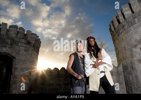 Portrait of a pirate armed with a pistol with castle turrets and ...