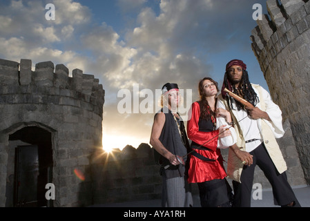 Portrait of a pirate armed with a pistol with castle turrets and ...
