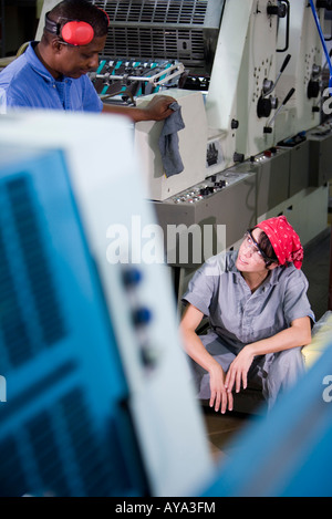 Vertical background image of printing machine in factory workshop, copy ...