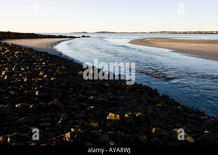 Low tide at the outlet of the Little River in Biddeford, Maine. Timber ...