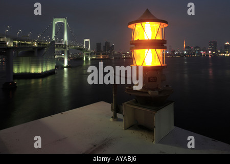 Asia Tokyo Japan Navigational light on Rainbow Bridge at dusk on spring ...