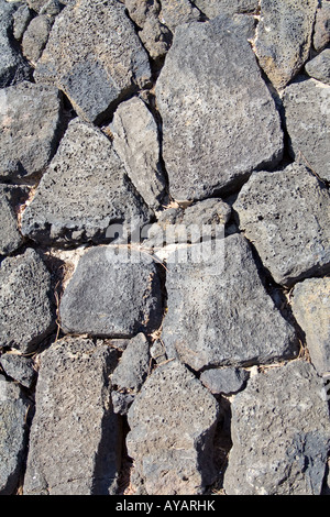 Old stone (basalt) / brick wall - background texture Stock Photo - Alamy