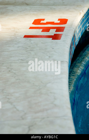 depth marker in kids swimming pool , sunshine toned Stock Photo - Alamy