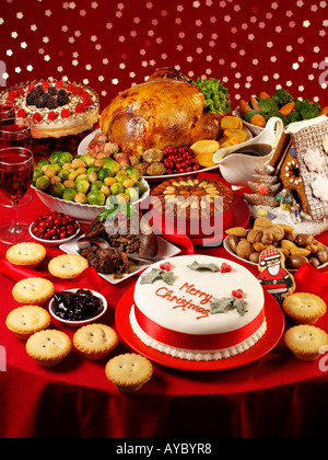 Seasonal food of roast turkey, mince pies and Christmas cake with a set ...