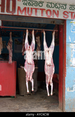Carcasses of sheep hanging for sale outside a mutton shop in Bangalore ...