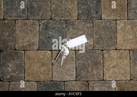 A set of house keys on a brick ground Stock Photo - Alamy