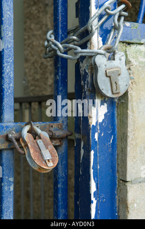 Two locked padlocks and rusty chain Stock Photo - Alamy
