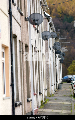 Terraced houses built to house colliery workers with coal tip above at ...