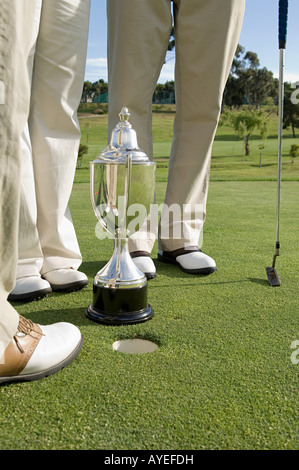 golfer winner with trophy Stock Photo - Alamy