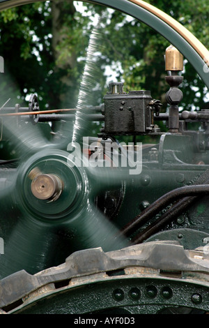 Vintage Steam Traction Locomotive with flywheel driving a belt driving ...
