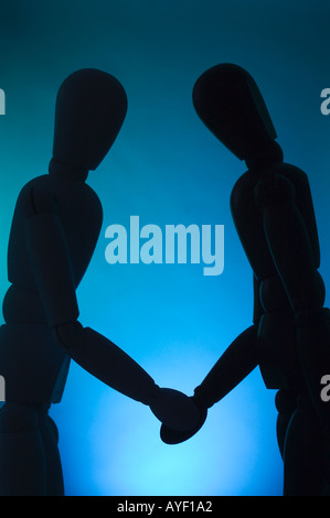 Two figures shaking hands Stock Photo - Alamy