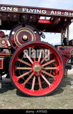 Traditional vintage bright red tractor mechanical engine and frame ...