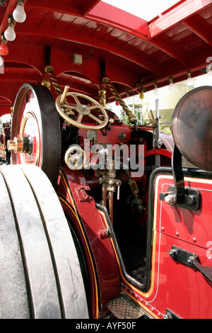 Traditional vintage bright red tractor mechanical engine and frame ...