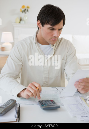 A man preparing to do his taxes Stock Photo - Alamy