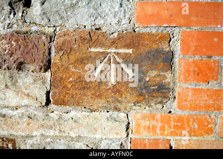An Ordnance Survey Benchmark in stone on the south-west corner of the ...