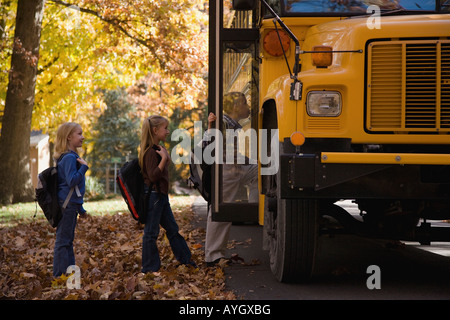 Children getting on school bus Stock Photo - Alamy