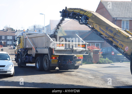 Road planing machine filling a tipper truck Stock Photo - Alamy